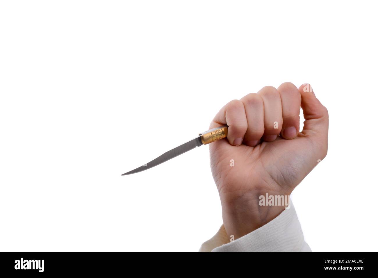 Hand holding a knife in hand on a white background Stock Photo - Alamy