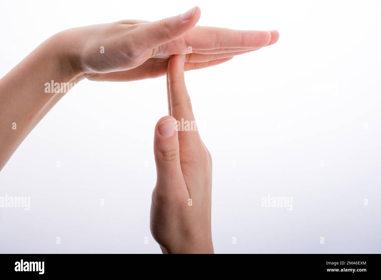 Break time hand gesture on a white background Stock Photo - Alamy