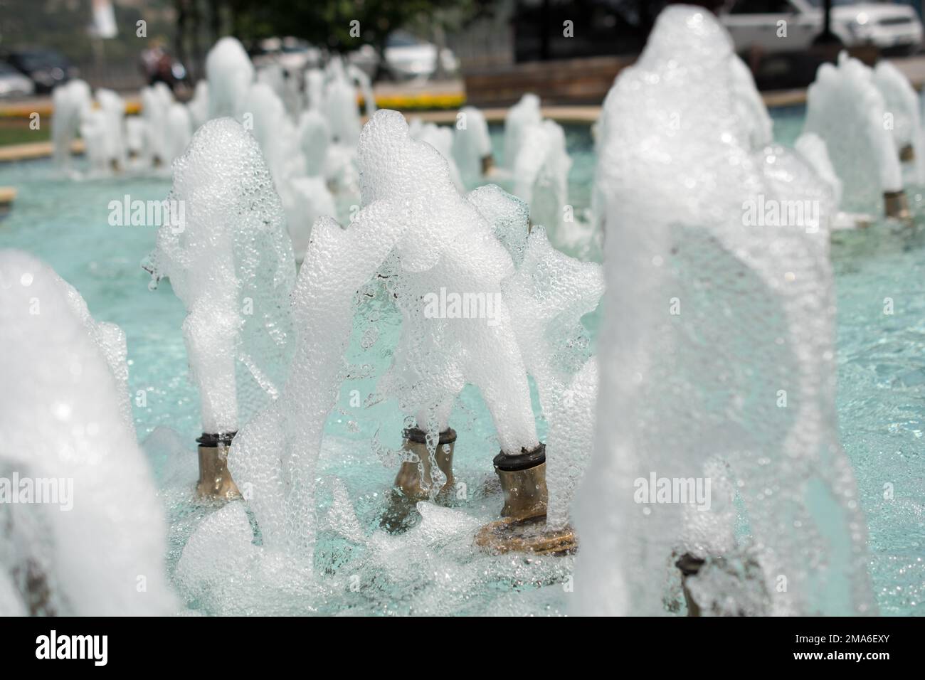 The fountains gushing sparkling water in a pool in a park Stock Photo ...