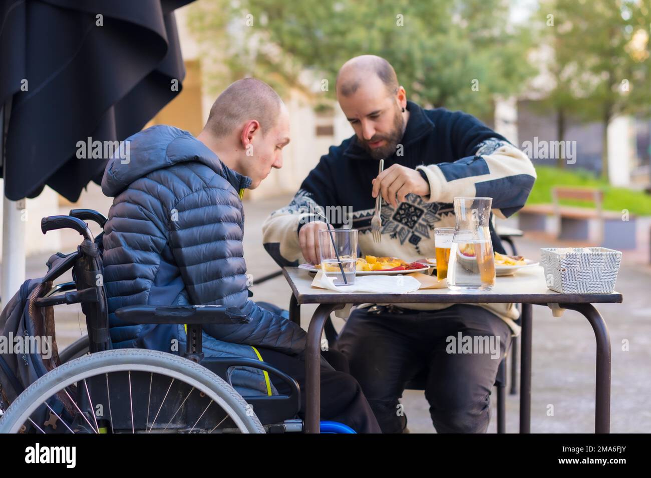 Disabled eating restaurant hi-res stock photography and images - Alamy