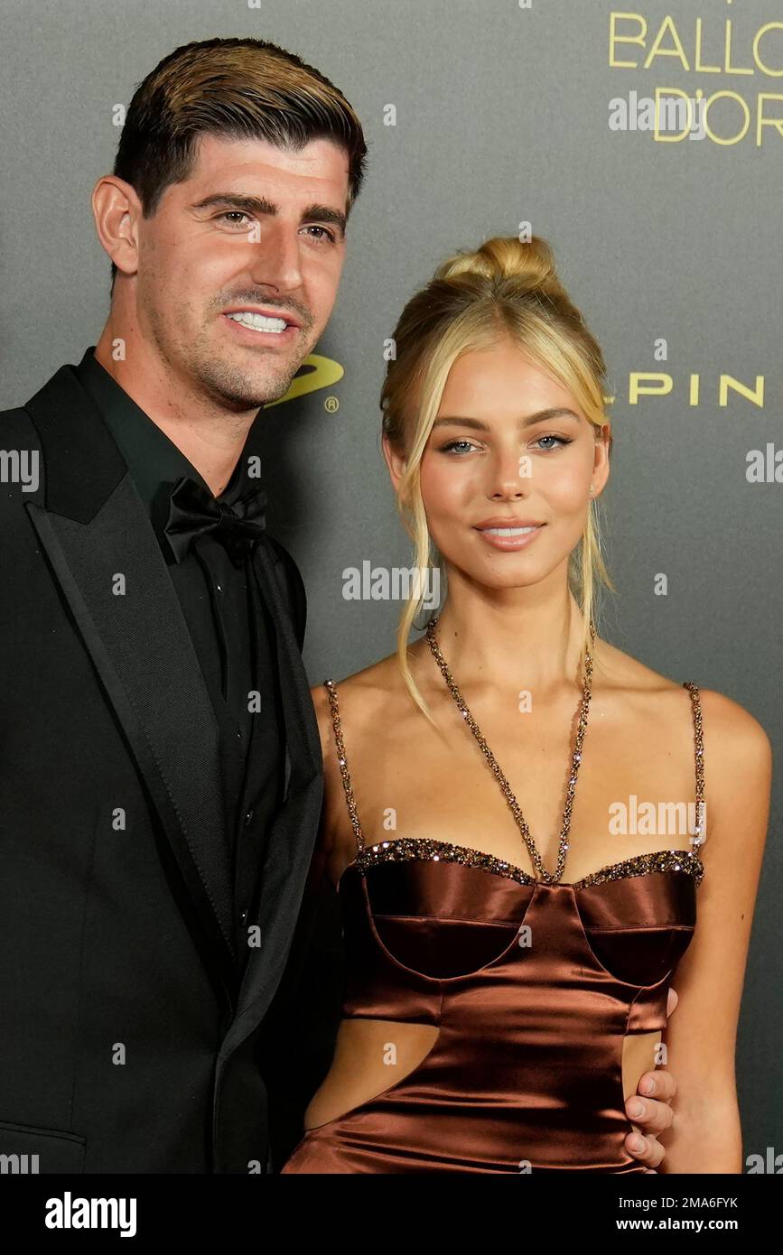 Real Madrid's Thibaut Courtois with his partner Mishel Gerzig pose for ...