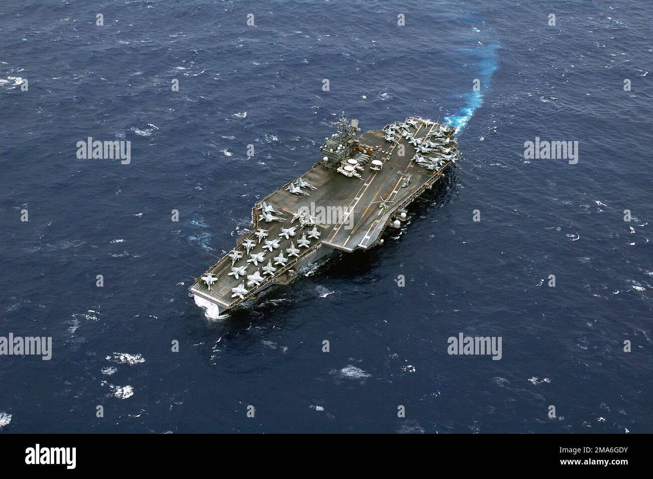 Aerial view of the US Navy (USN) Aircraft Carrier, USS KITTY HAWK (CV ...