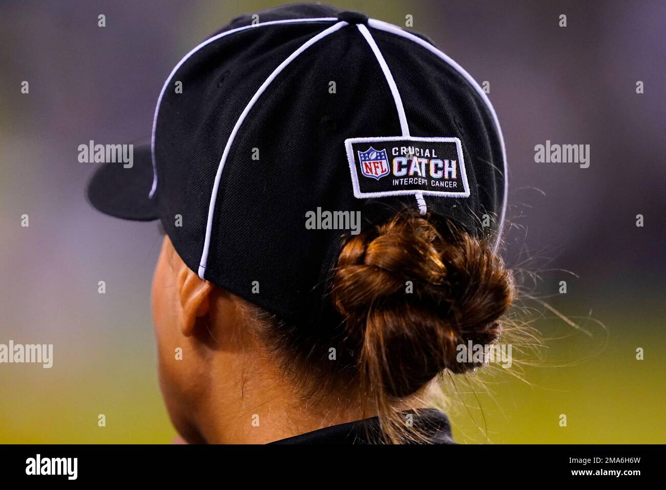 Down Judge Robin Delorenzo with Crucial Catch hat in action during an ...