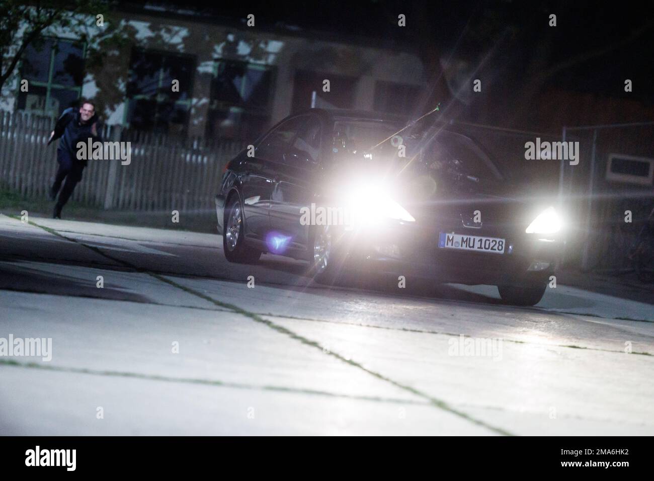 Munich, Germany. 05th May, 2022. Actor Dennis Scheuermann follows a car ...