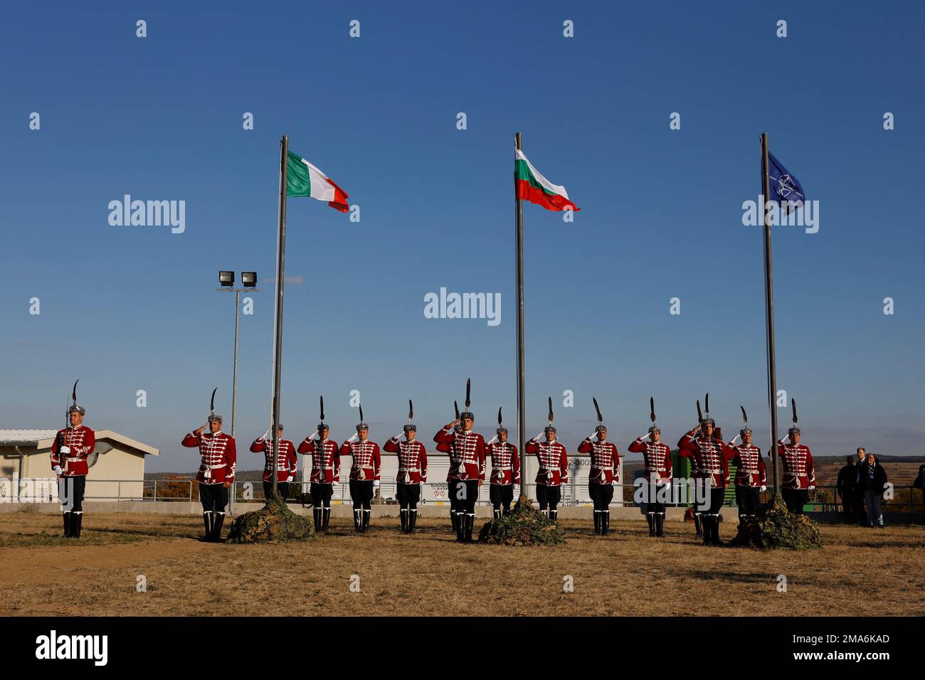 Flags of Italy, Bulgaria and NATO are raised during official ceremony ...
