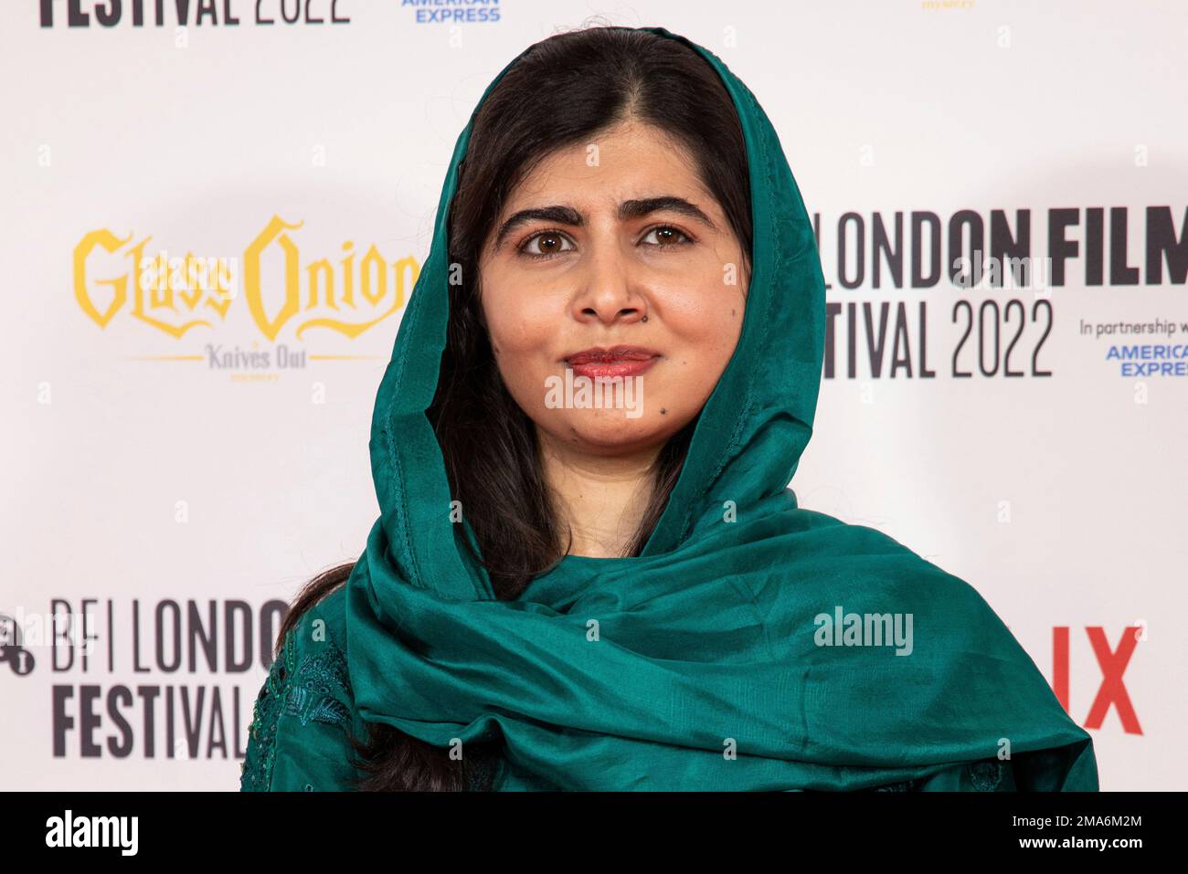 Malala Yousafzai poses for photographers upon arrival for the premiere of the film 'Glass Onion ...