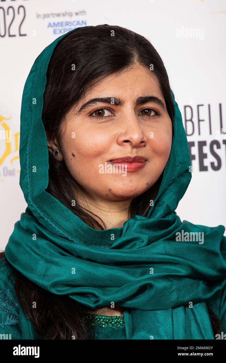 Malala Yousafzai poses for photographers upon arrival for the premiere of the film 'Glass Onion ...