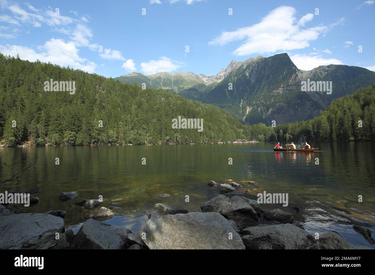 Rowing boat on the Piburg Lake with view of Acherkogel 3007m in Oetz ...