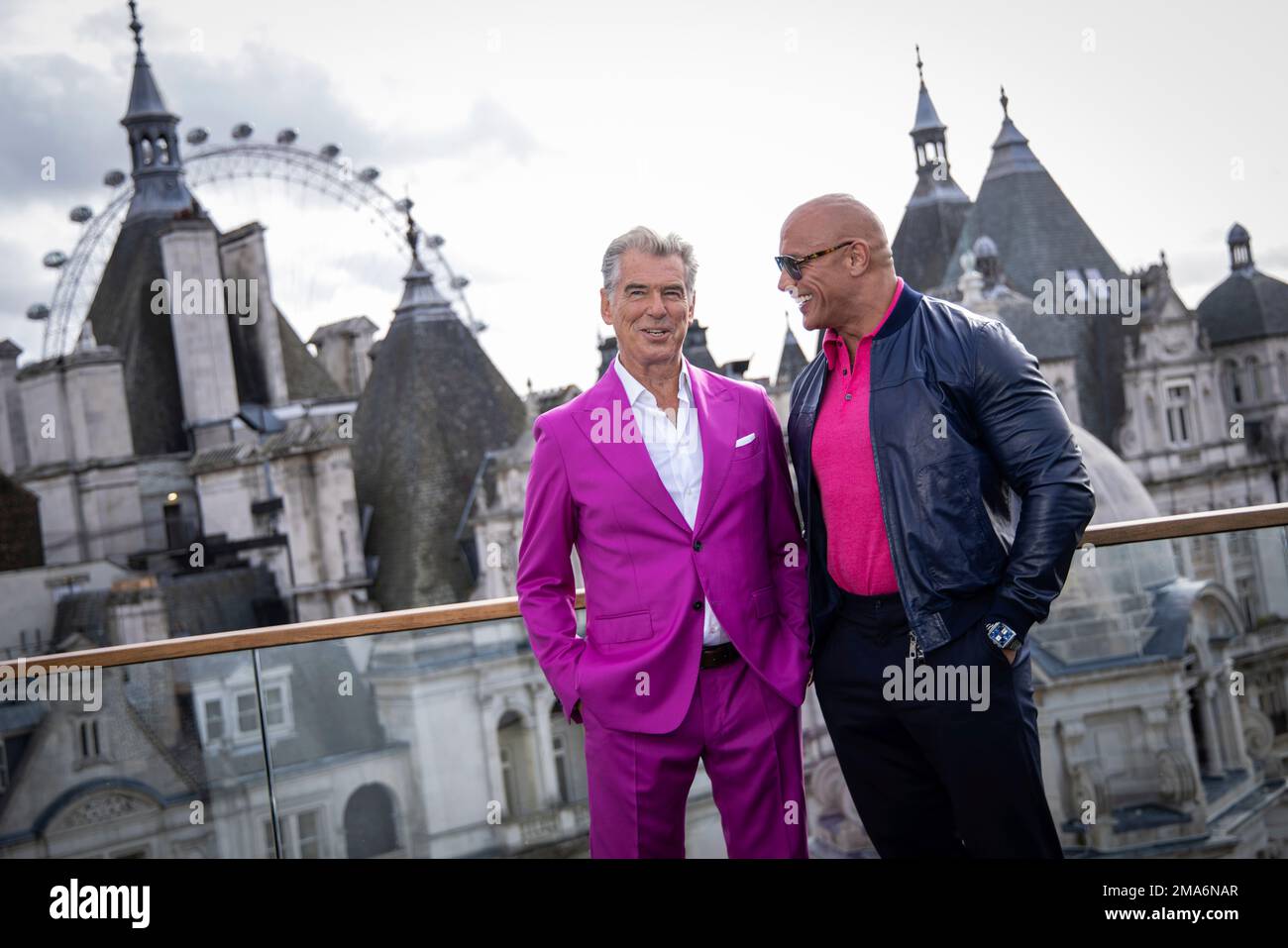 Pierce Brosnan, left, and Dwayne Johnson a.k.a. The Rock pose for ...