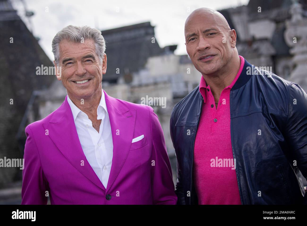 Pierce Brosnan, left, and Dwayne Johnson a.k.a. The Rock pose for ...