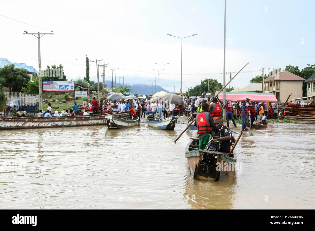FILE- People stranded due to floods following several days of downpours ...