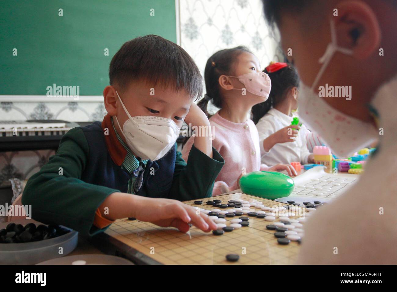 Two boys play Paduk and other children play with toys at the Ryonmot ...