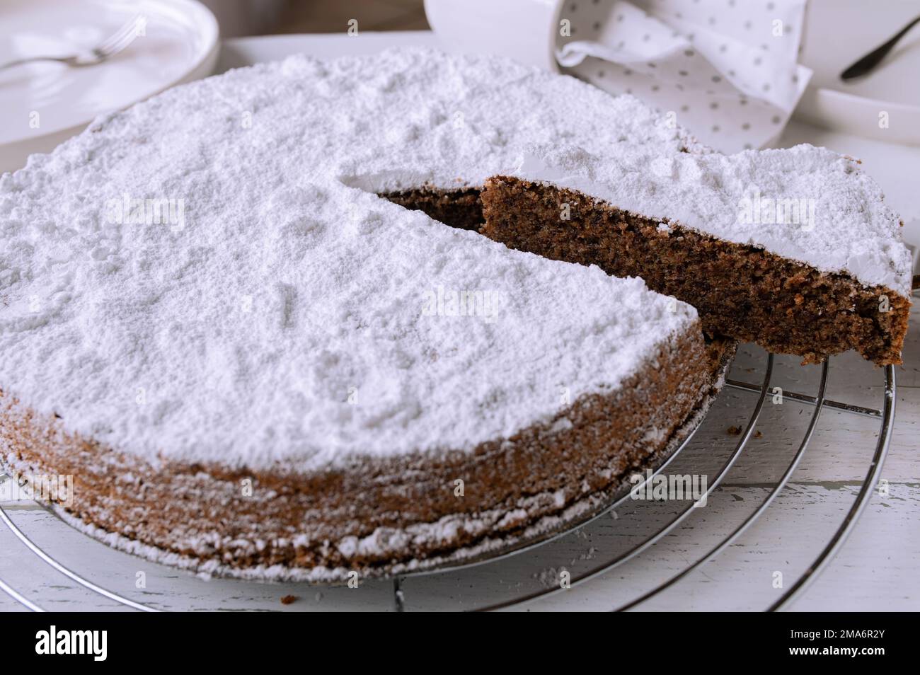 Juicy chocolate almond cake on a cooling rack. Traditional italian ...