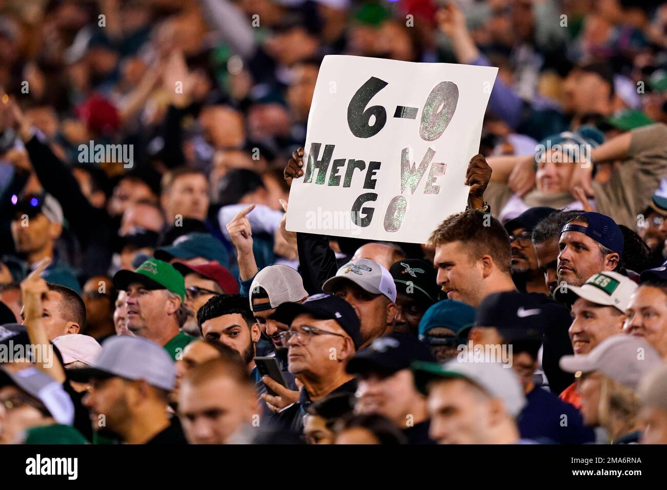 A Philadelphia Eagles fan holds a sign for the undefeated Eagles during ...