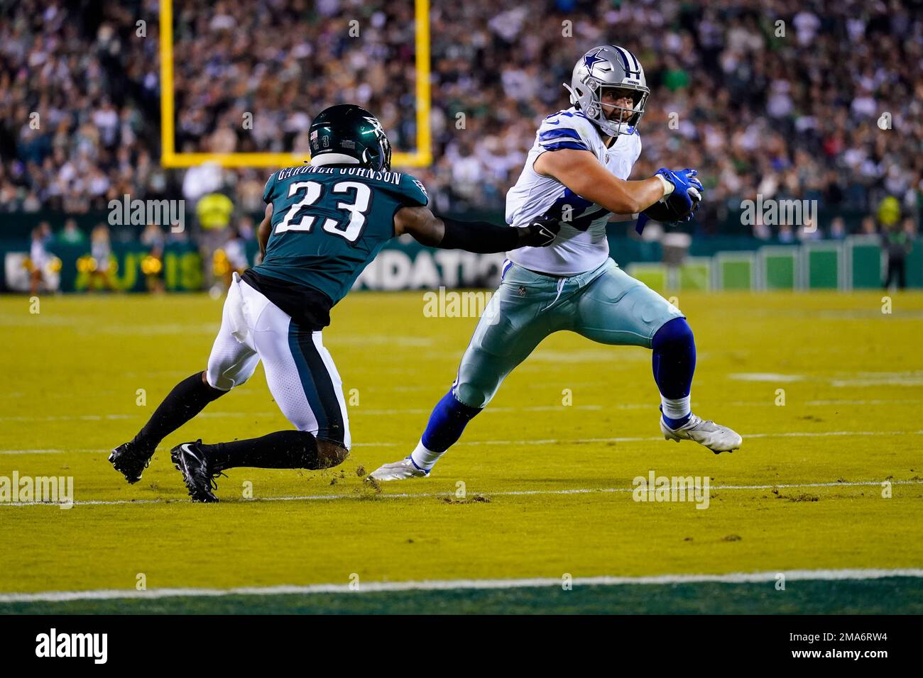 Dallas Cowboys' Jake Ferguson runs past Philadelphia Eagles' C.J ...