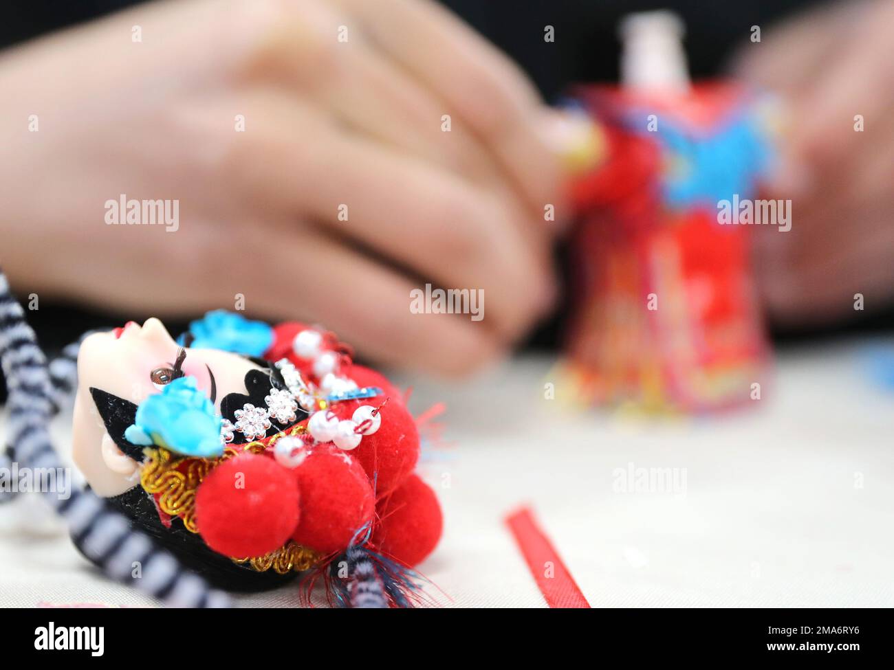 QINGDAO, CHINA - JANUARY 19, 2023 - Foreign students make silk crafts ...