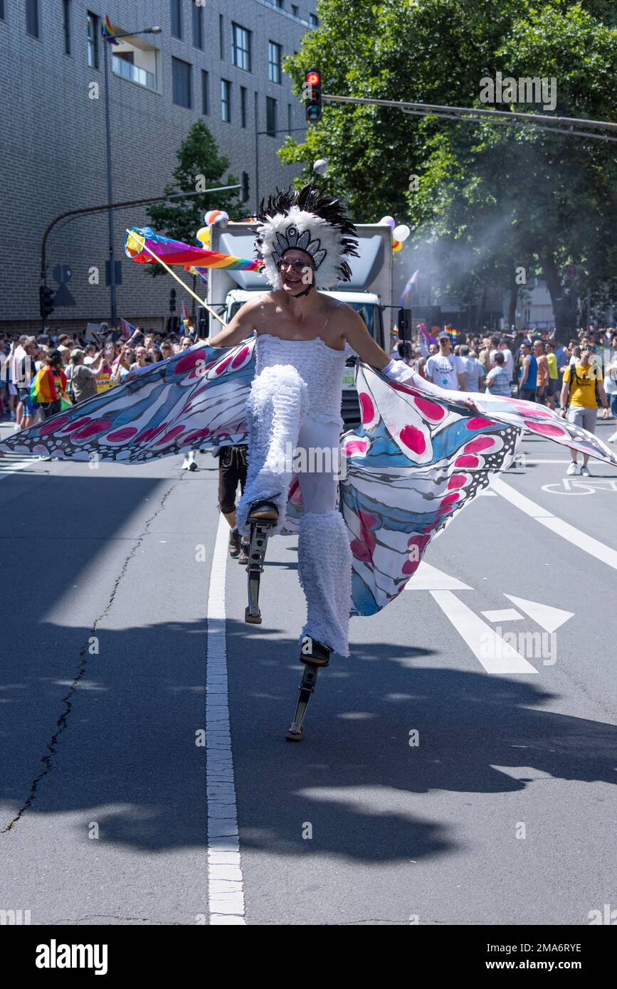 Transvestite costumed as a butterfly on stilts at the CSD parade ...