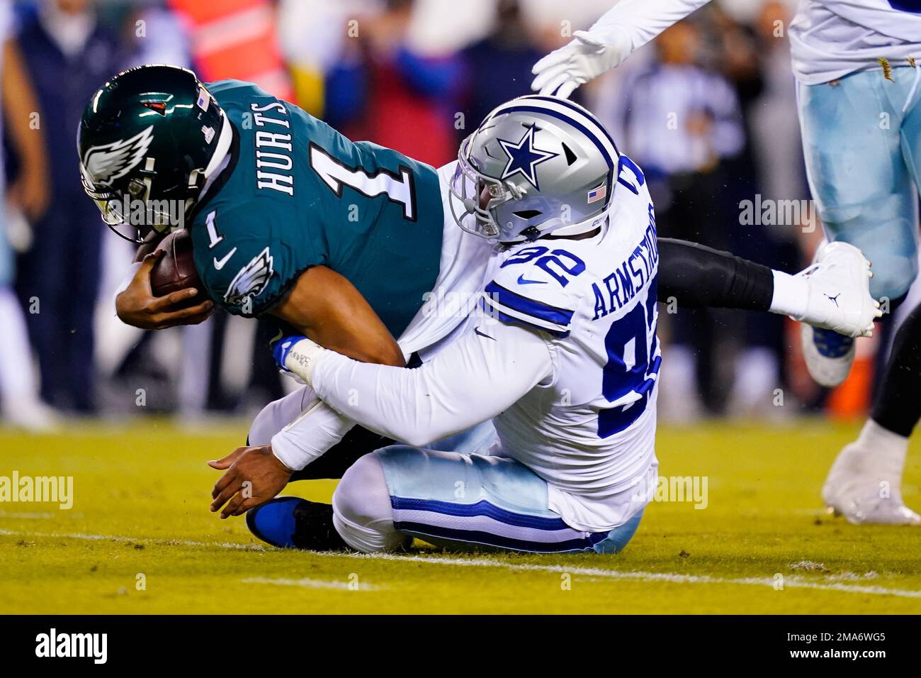 Dallas Cowboys' Dorance Armstrong tackles Philadelphia Eagles' Jalen ...