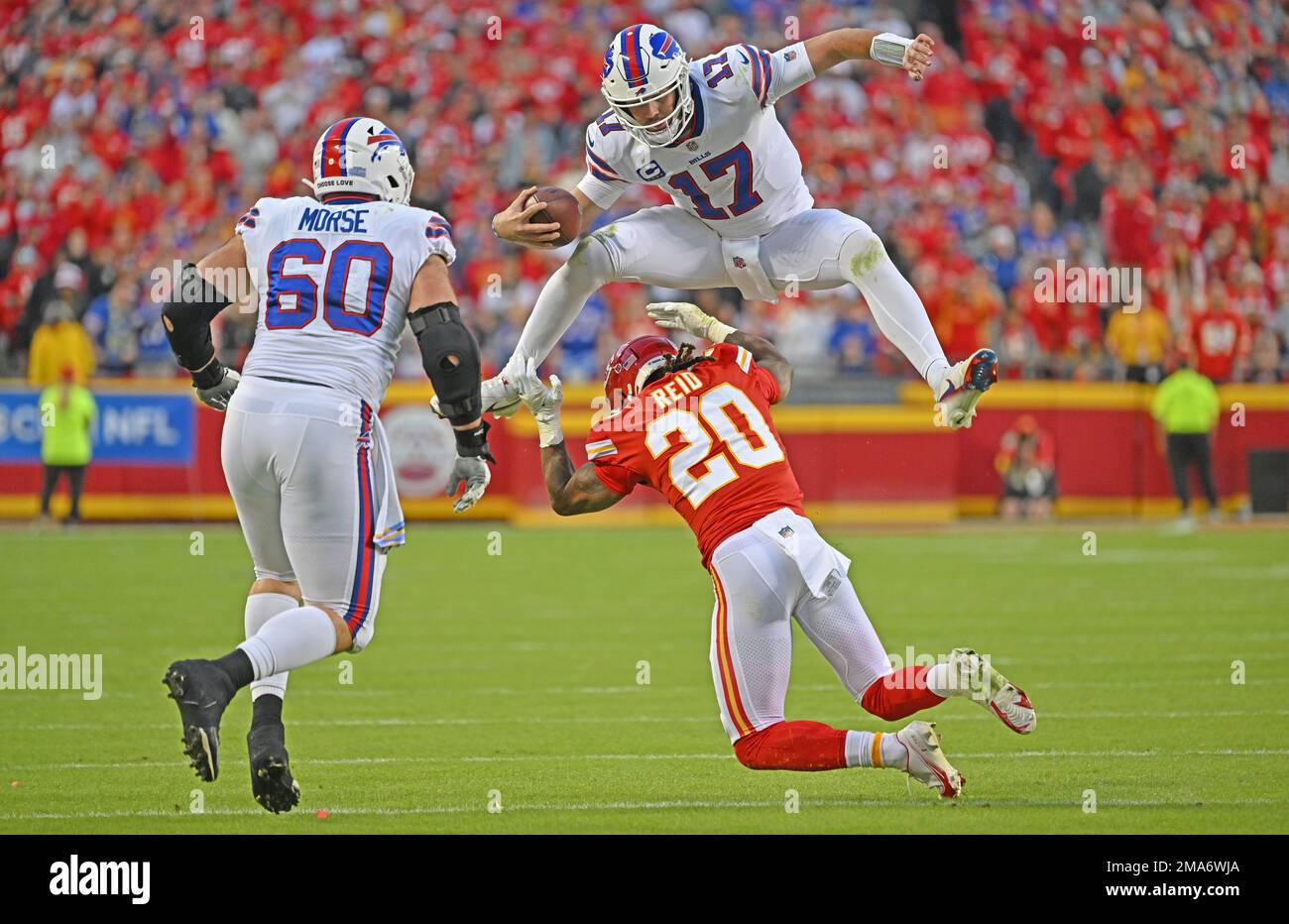 Buffalo Bills quarterback Josh Allen (17) hurdles Kansas City Chiefs safety Justin Reid (20 ...