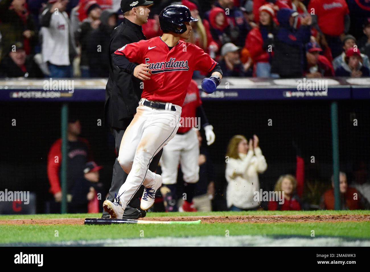 Cleveland Guardians' Steven Kwan scores on a hit by Jose Ramirez in the ...