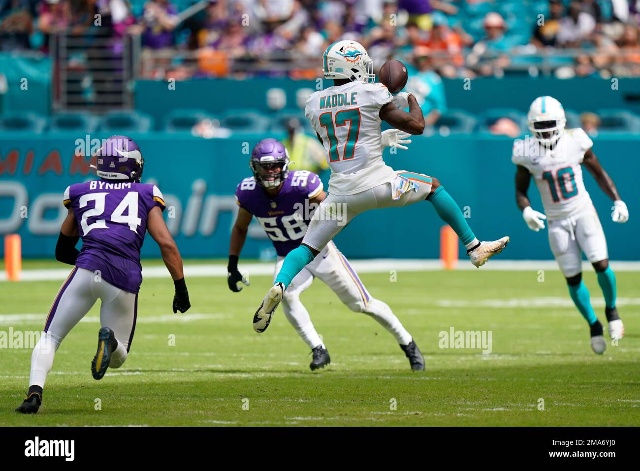 Miami Dolphins wide receiver Jaylen Waddle (17) loses his grip on a ...