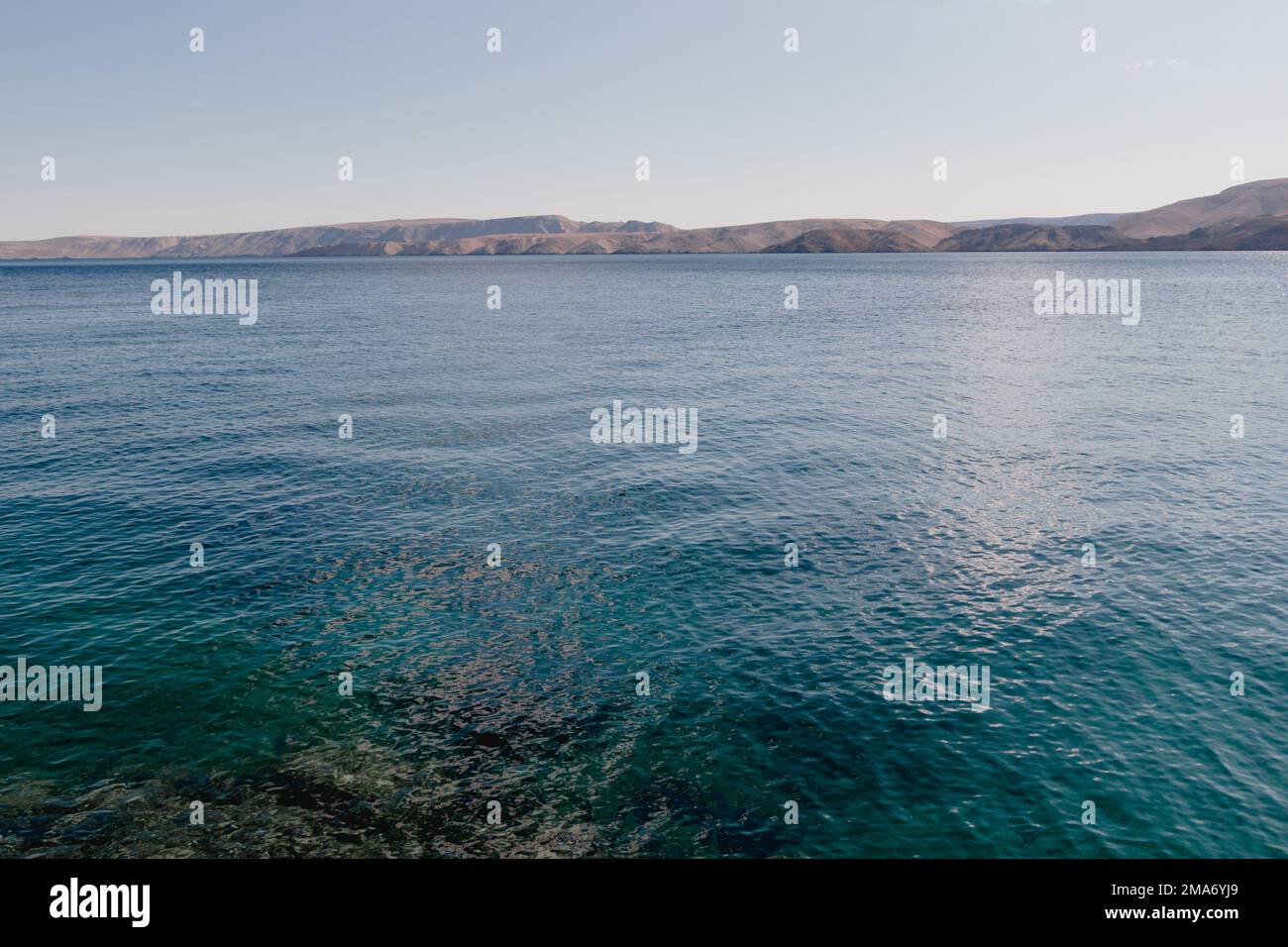 Summer coastline near an island on the deep blue ocean Stock Photo - Alamy