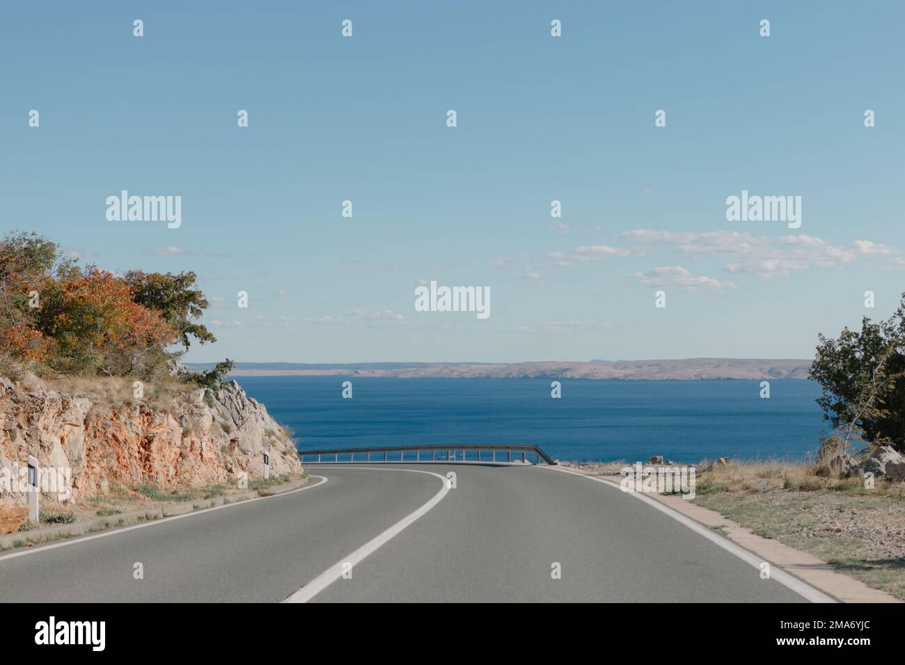Road in the middle of on island with a breathtaking view Stock Photo ...