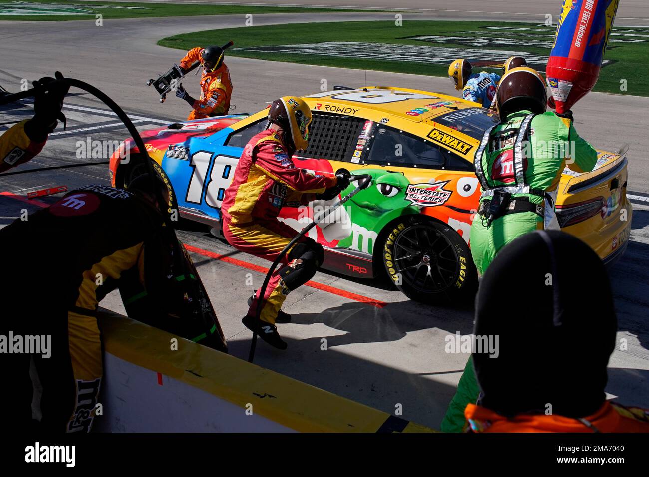 Kyle Busch (18) makes a pit stop during a NASCAR Cup Series auto race ...