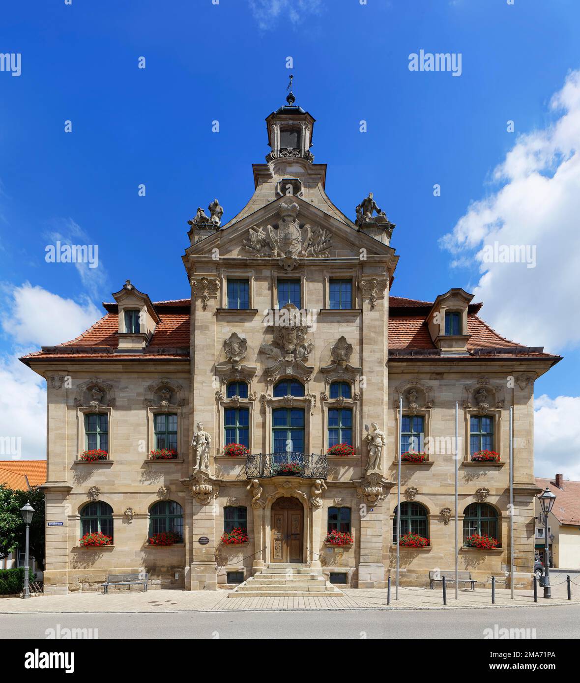 Town hall with rich facade decoration, two-storey mansard roof building ...