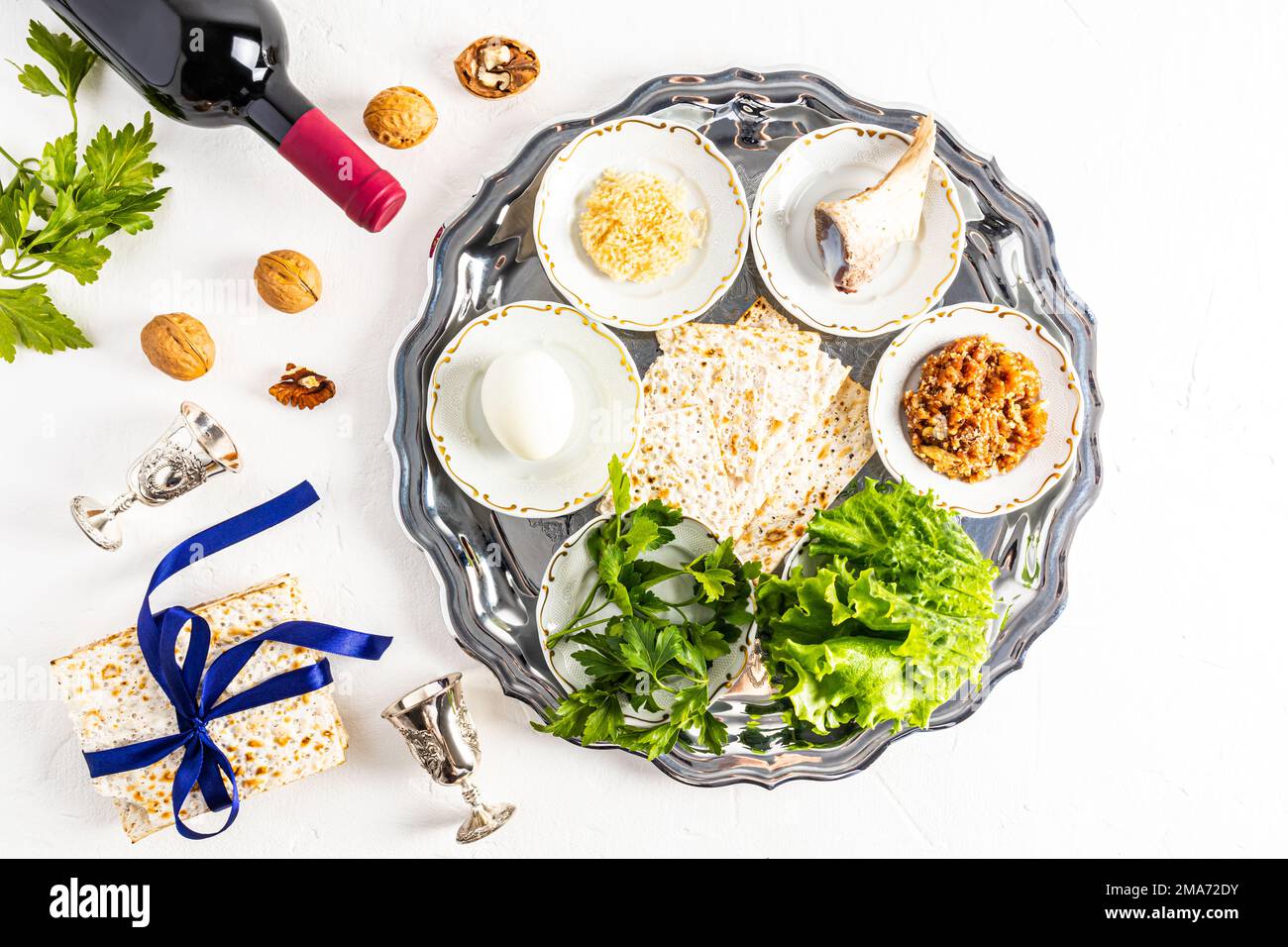 a silver plate with traditional Jewish treats for Passover. baked egg ...