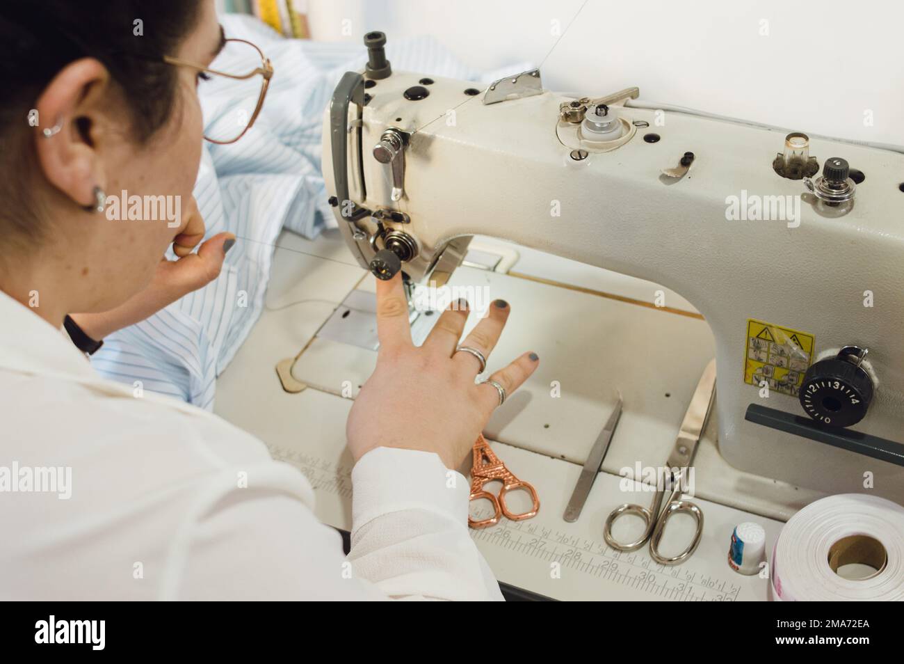 Woman needle threading studio hi-res stock photography and images - Alamy