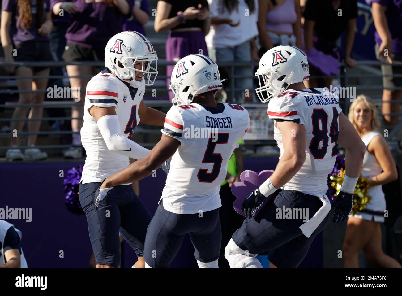Arizona wide receiver Tetairoa McMillan, left, celebrates a touchdown ...