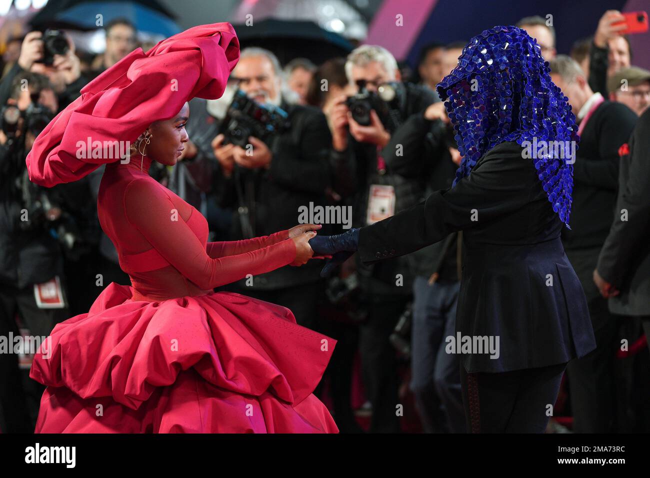 Janelle Monae, left, greets Grace Jones upon arrival for the premiere of the film 'Glass Onion ...