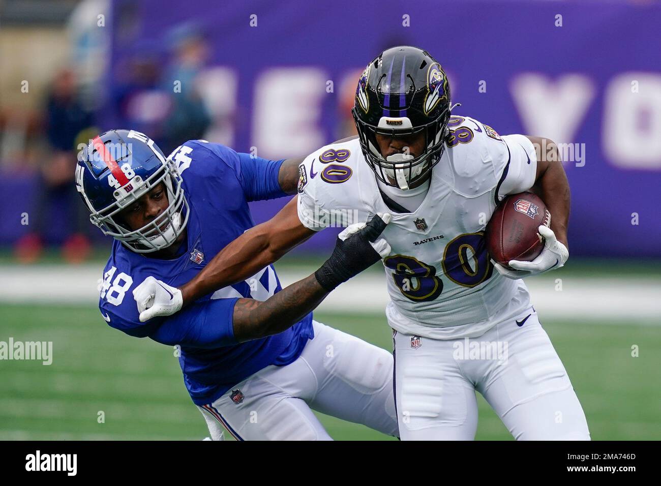 New York Giants' Tae Crowder (48) tackles Baltimore Ravens' Isaiah ...