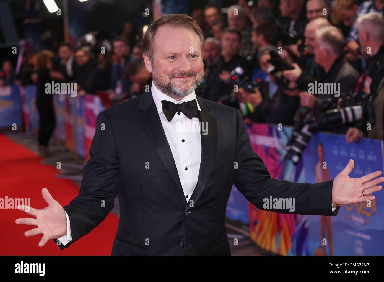 Director Rian Johnson poses for photographers upon arrival for the ...