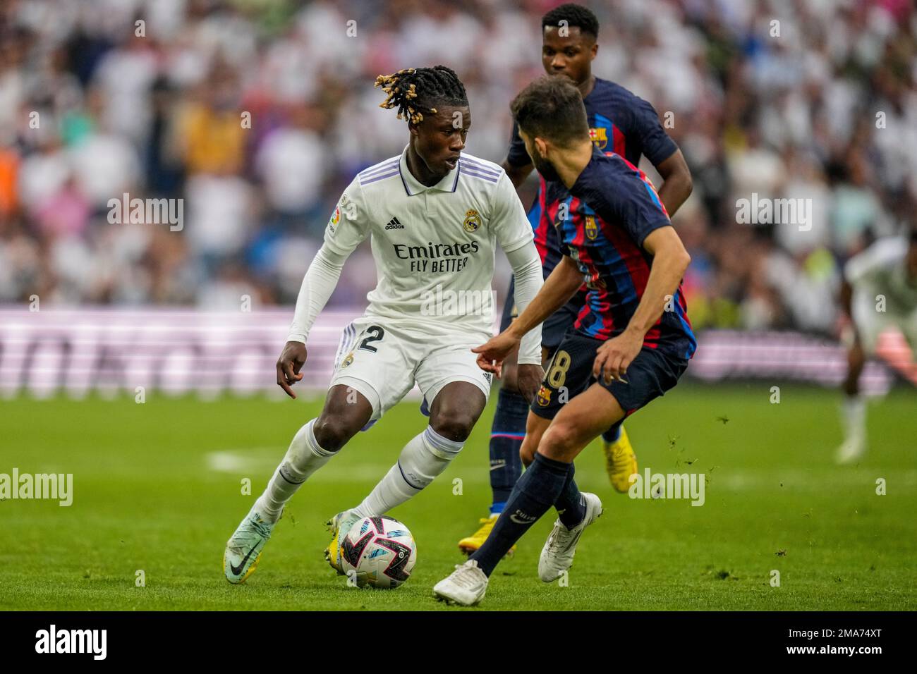 Real Madrid's Eduardo Camavinga, left, duels for the ball with ...