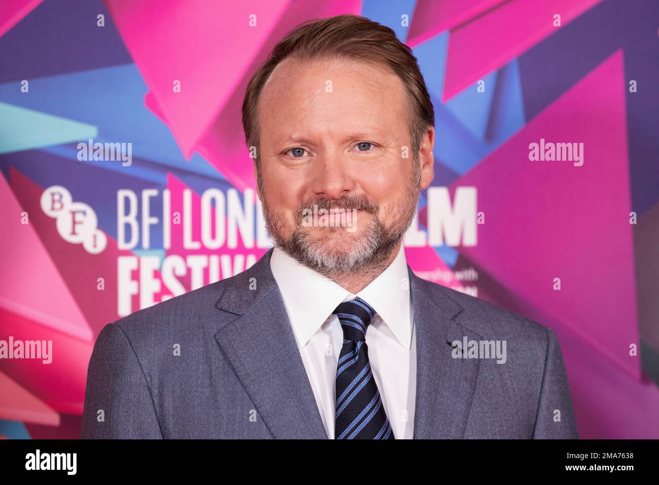 Director Rian Johnson poses for photographers upon arrival at the photo ...