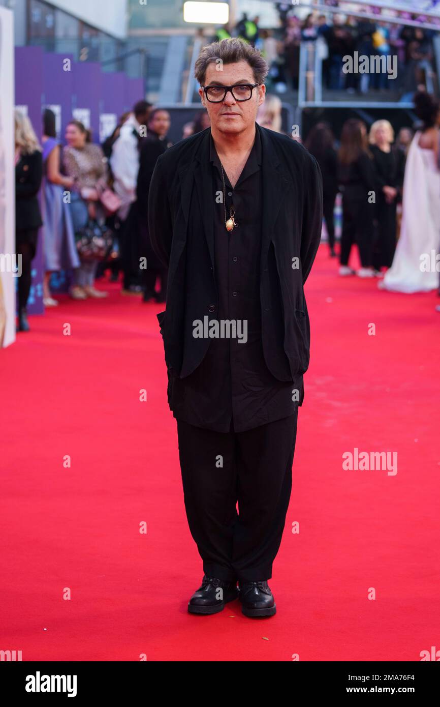 Joe Wright poses for photographers upon arrival for the premiere of the ...