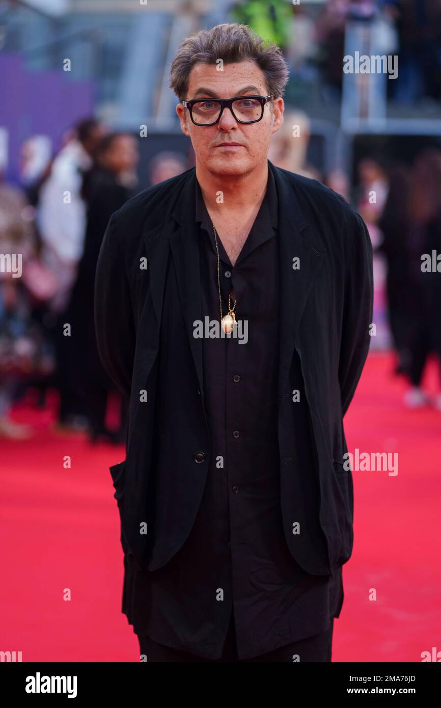 Joe Wright poses for photographers upon arrival for the premiere of the ...