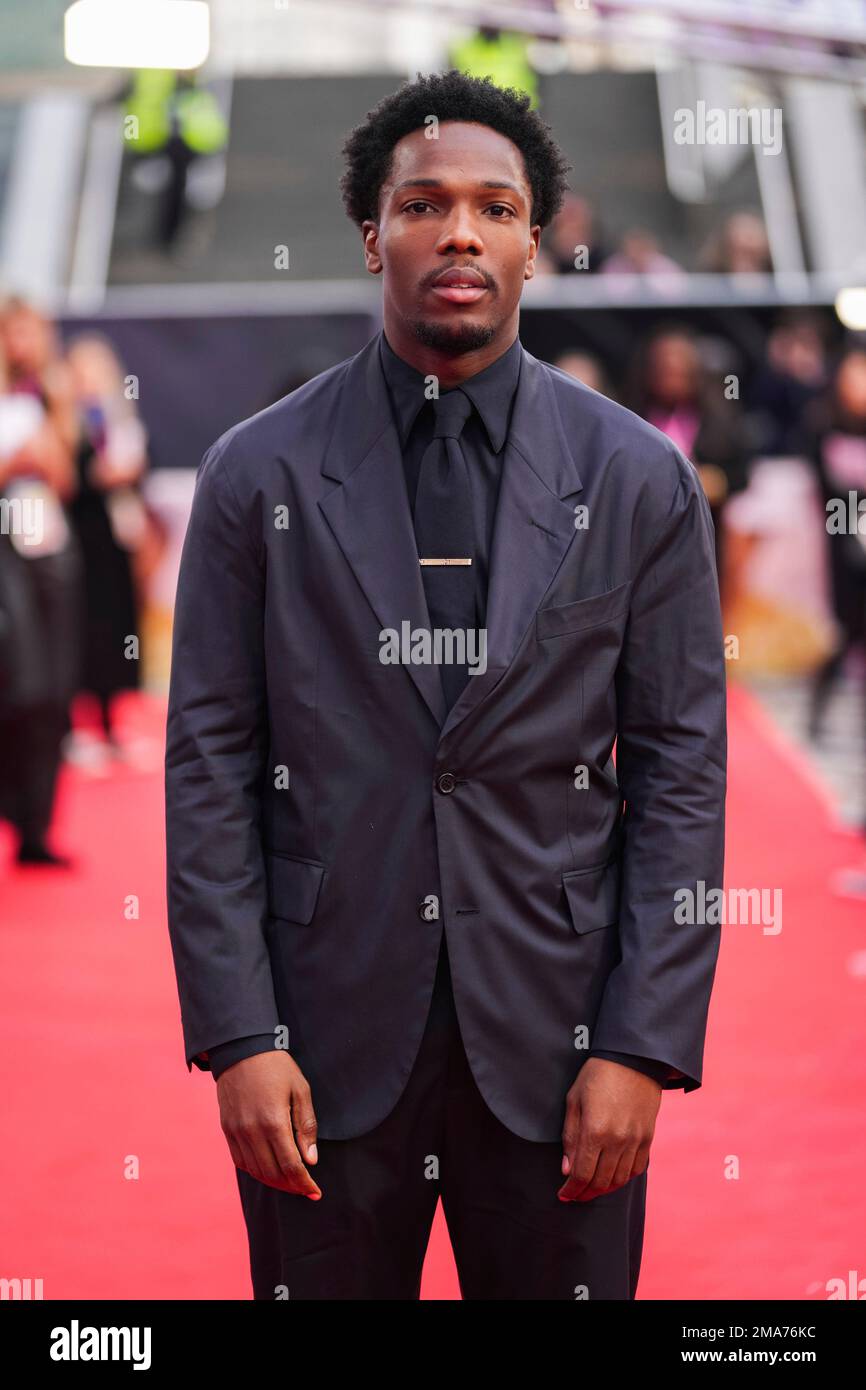 Tosin Cole poses for photographers upon arrival for the premiere of the ...