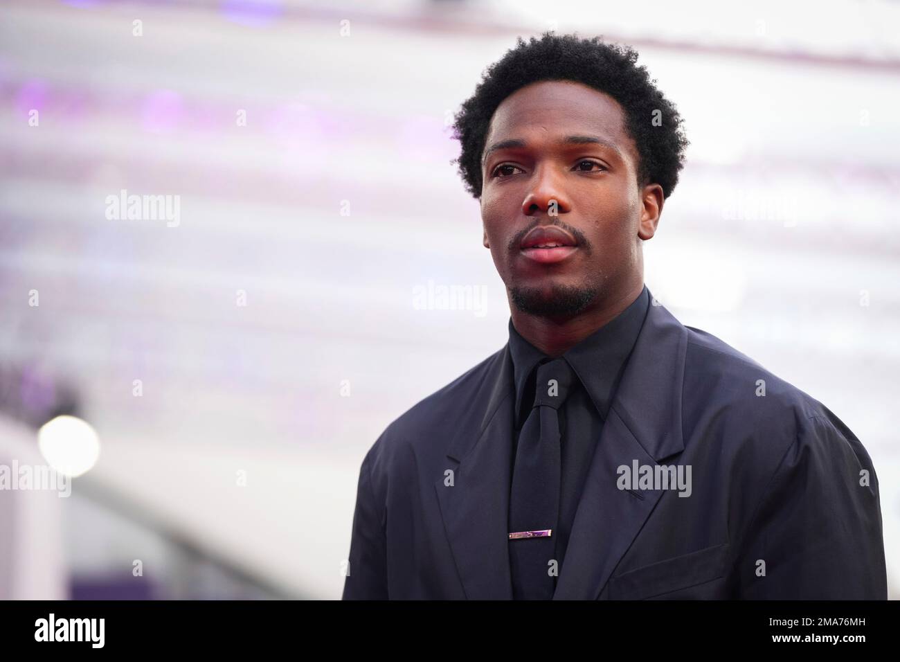 Tosin Cole poses for photographers upon arrival for the premiere of the ...