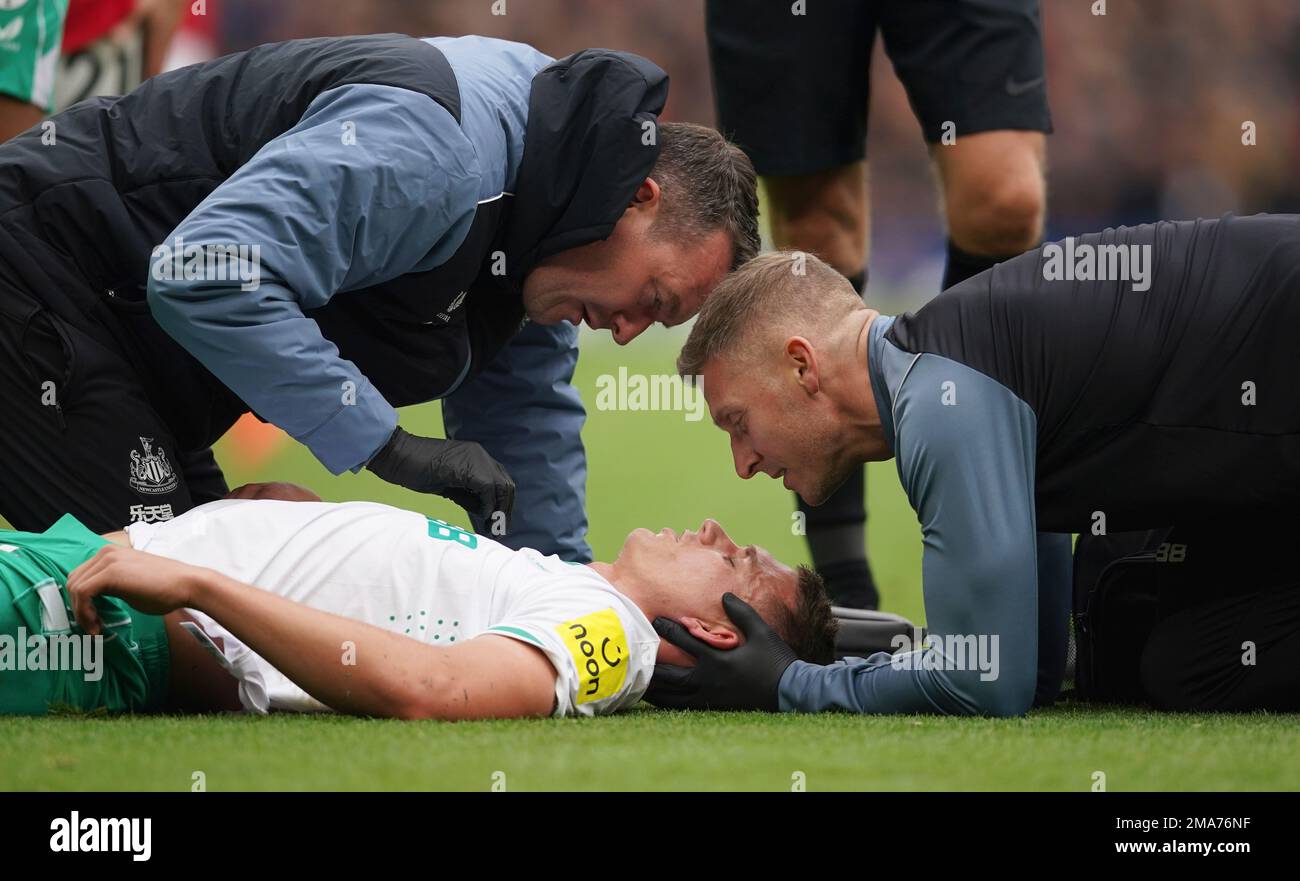Newcastle's Sven Botman receives medical attention during the English ...