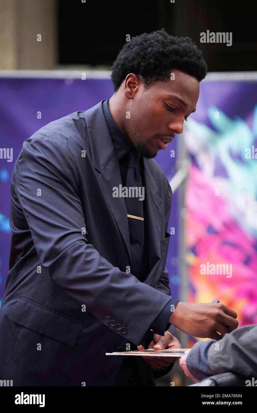 Tosin Cole signs an autograph upon arrival for the premiere of the film ...