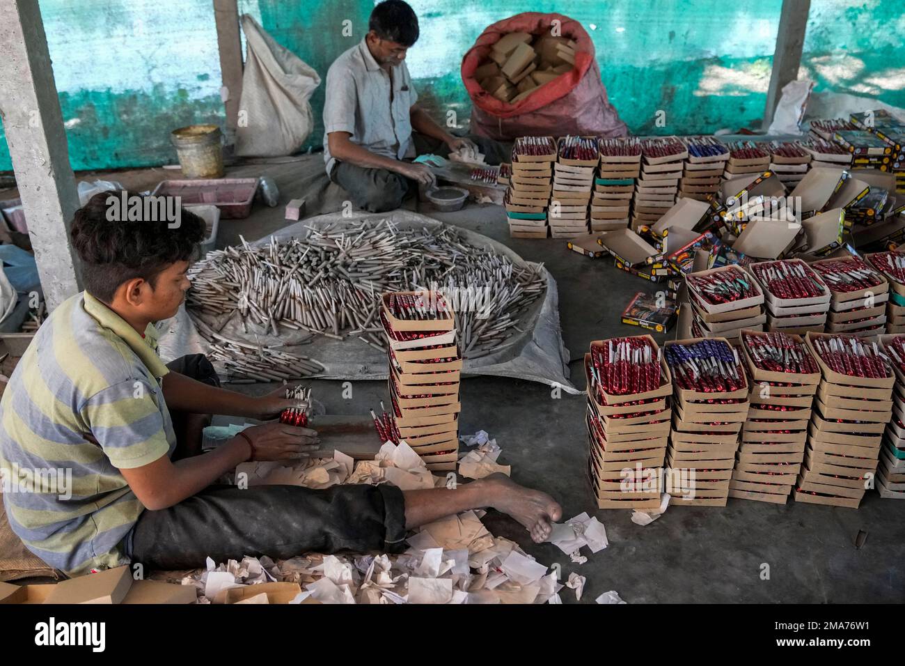 Indian workers make firecrackers for the upcoming Hindu festival Diwali at a factory on the ...