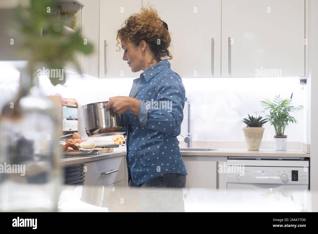 Woman alone eating pasta hi-res stock photography and images - Alamy