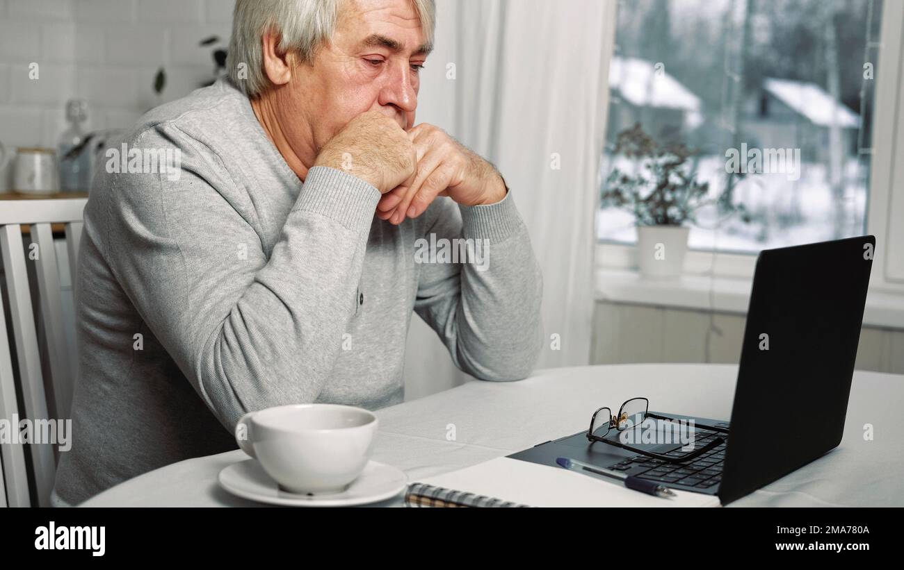 Busy Tired Old Man Using Laptop working from home. Manager Rests His ...
