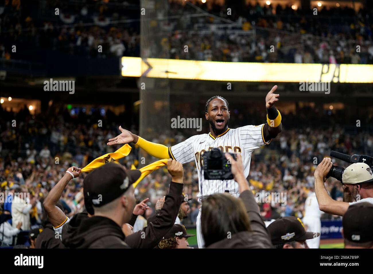 San Diego Padres left fielder Jurickson Profar reacts with fans during ...