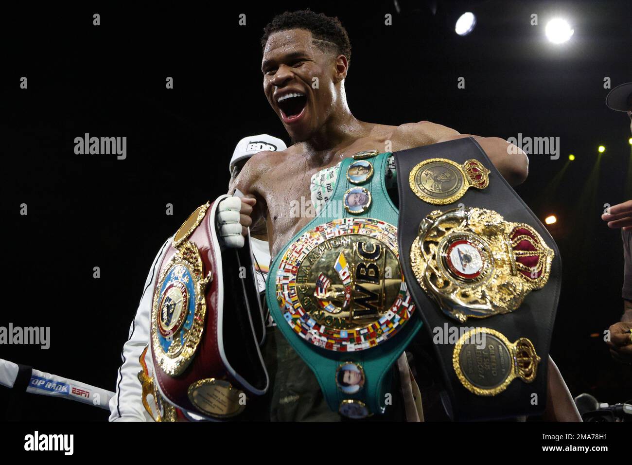 United States' Devin Haney displays his belts after defeating George ...