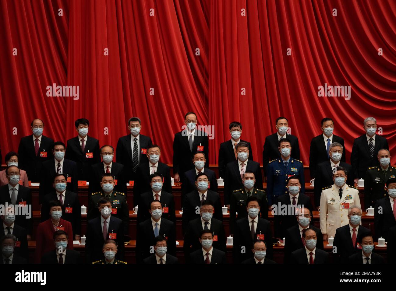 Delegates wear masks as they attend the opening ceremony of the 20th ...