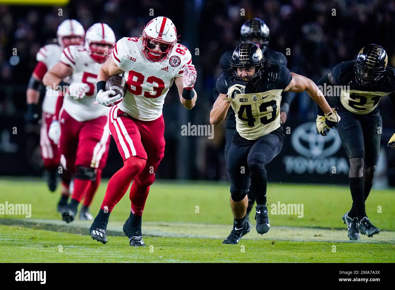 Nebraska tight end Travis Vokolek (83) runs for a first down in front of Purdue linebacker ...